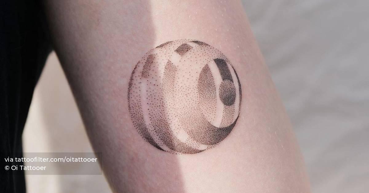Dotwork circle tattoo on the inner arm.