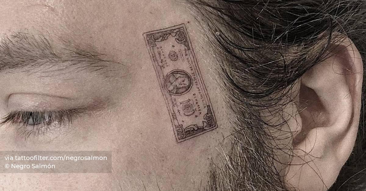 Dollar bill tattoo on the face.