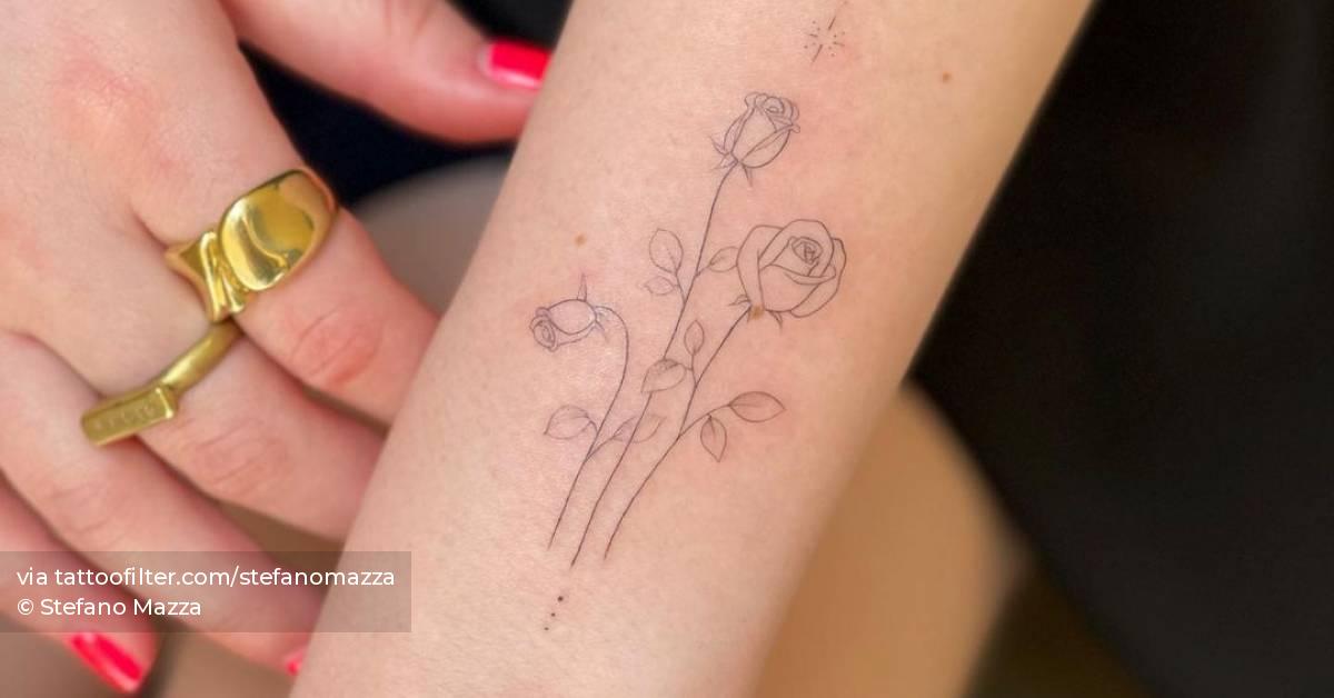 Fine line roses tattoo on the wrist.