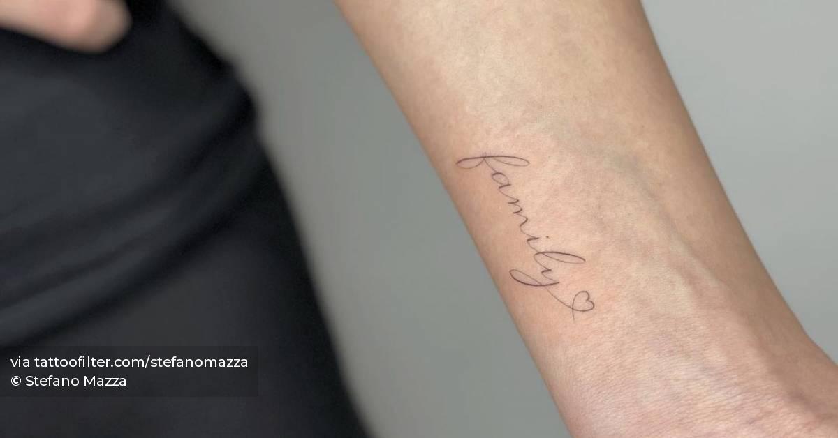 "Family" lettering tattoo on the wrist.