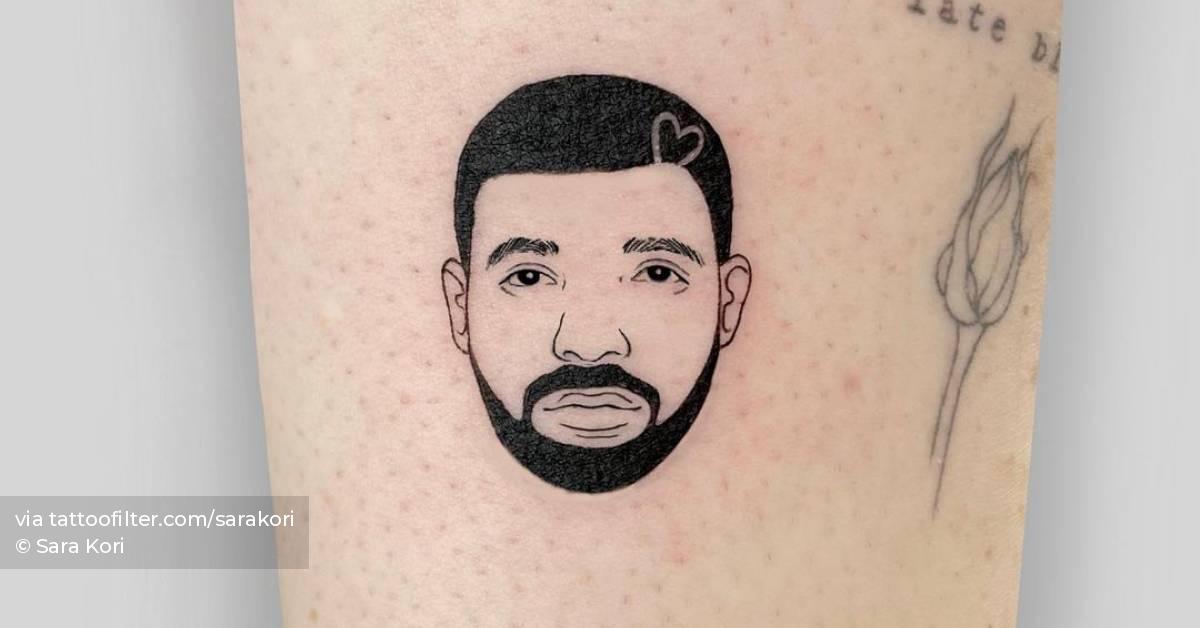 Drake portrait tattoo on the ankle.