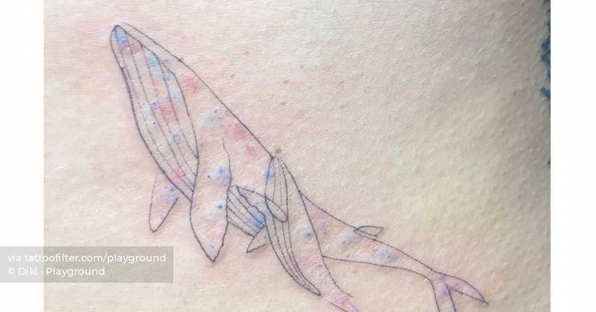 Fine line whales tattoo on the rib.