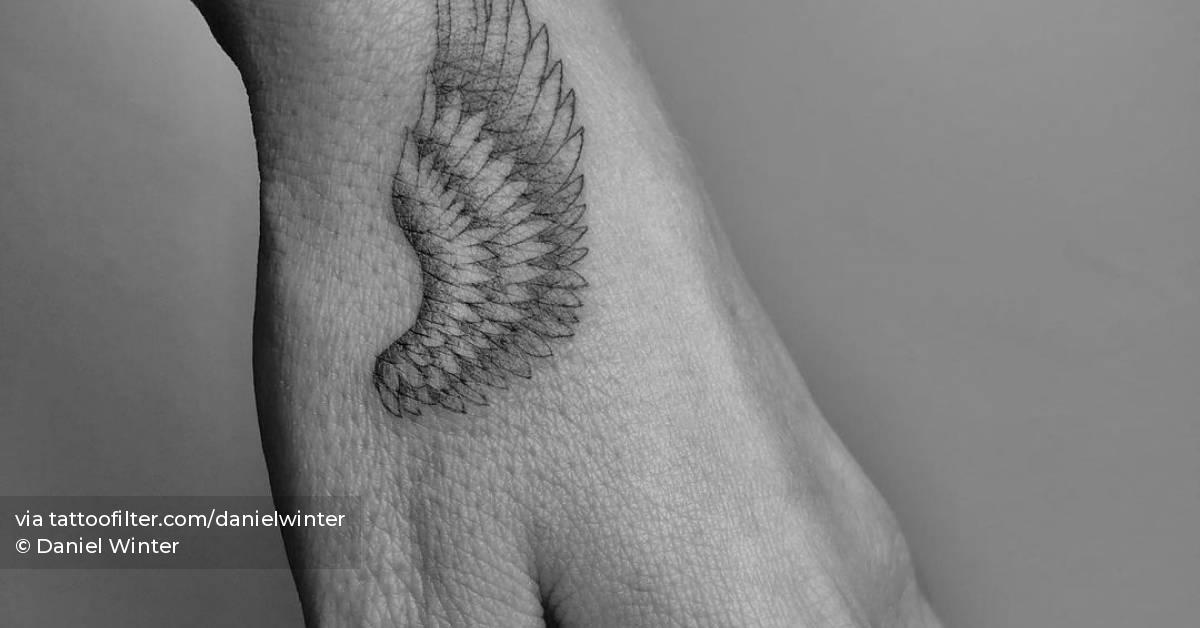 Wing tattoo on the hand.