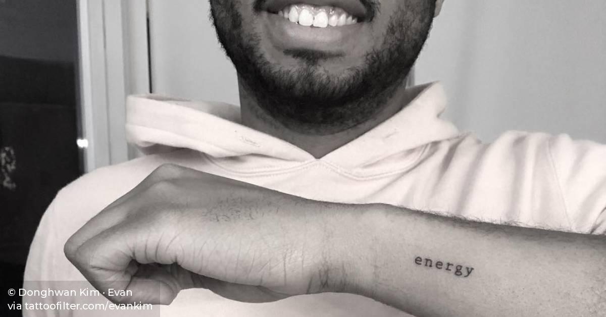 “Energy” tattoo on the wrist.