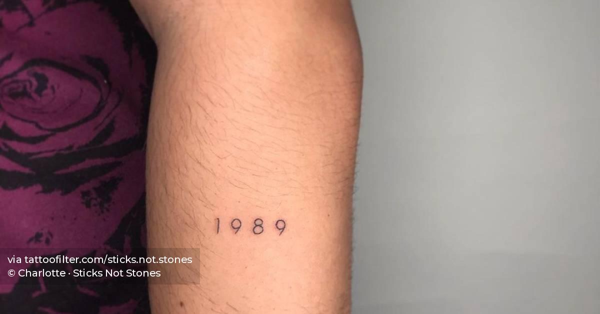 Teeny tiny "1989" hand poked on the forearm.