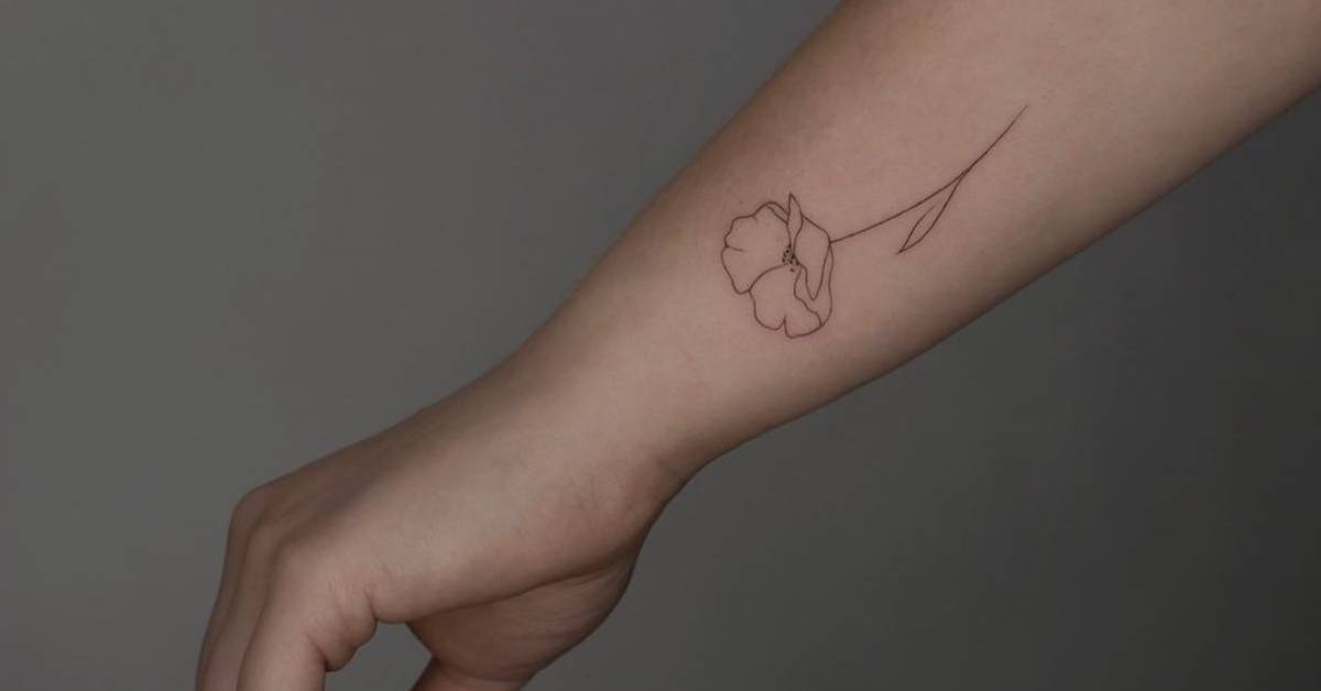 Cute poppy tattoo on the forearm, done in fine line.