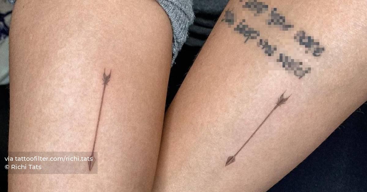 Individual matching arrows tattooed on the inner
