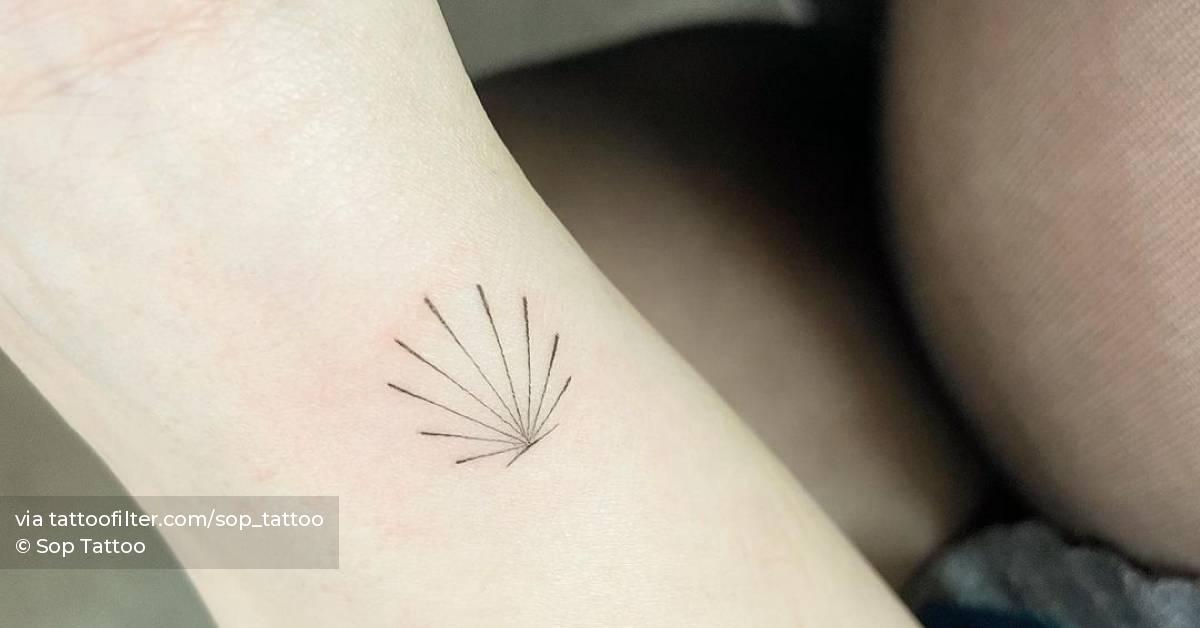 Minimalistic sea shell tattoo done in fine line,