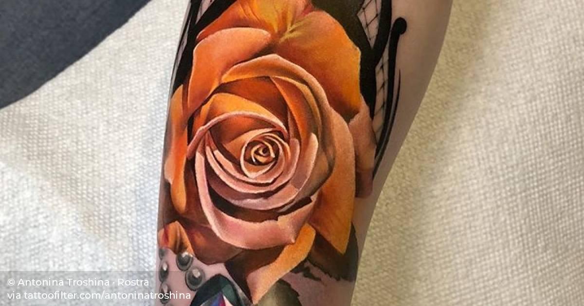 Yellow rose tattoo on the inner forearm.