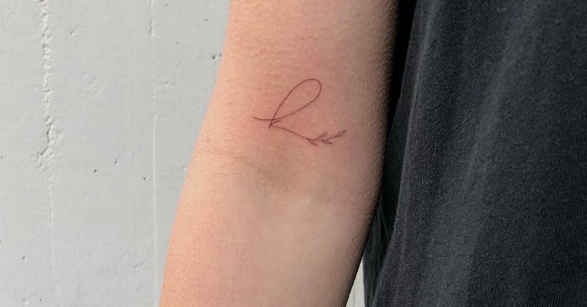 Minimalistic leaves tattoo, done in fine line, located