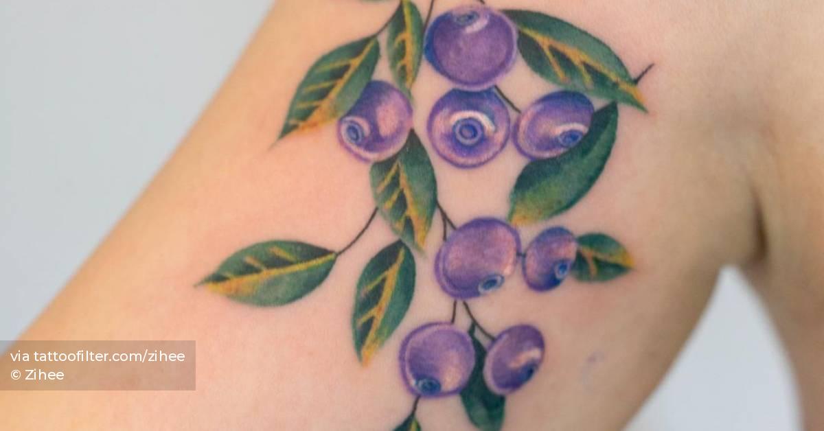 Bblueberris tattoo located on the inner arm, done in