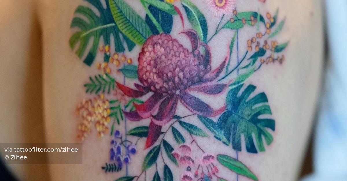 Floral tattoo piece done on the upper arm.
