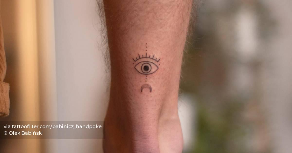 Hand poked evil eye tattoo done on the achilles.