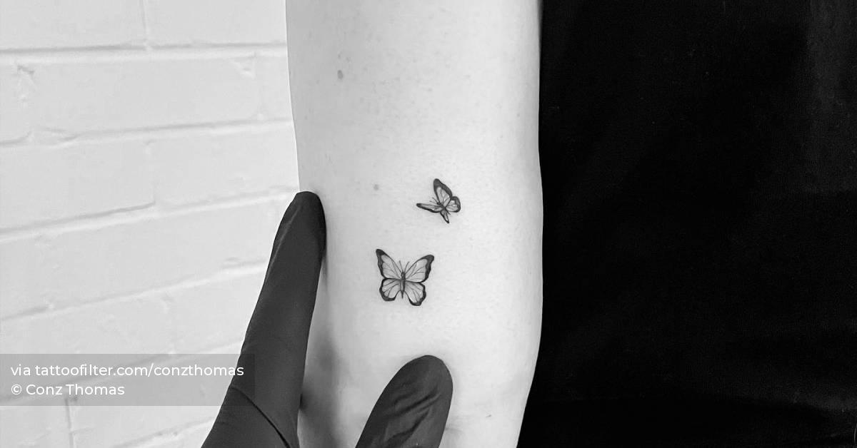 Fineline micro butterfly couple tattoo located on the