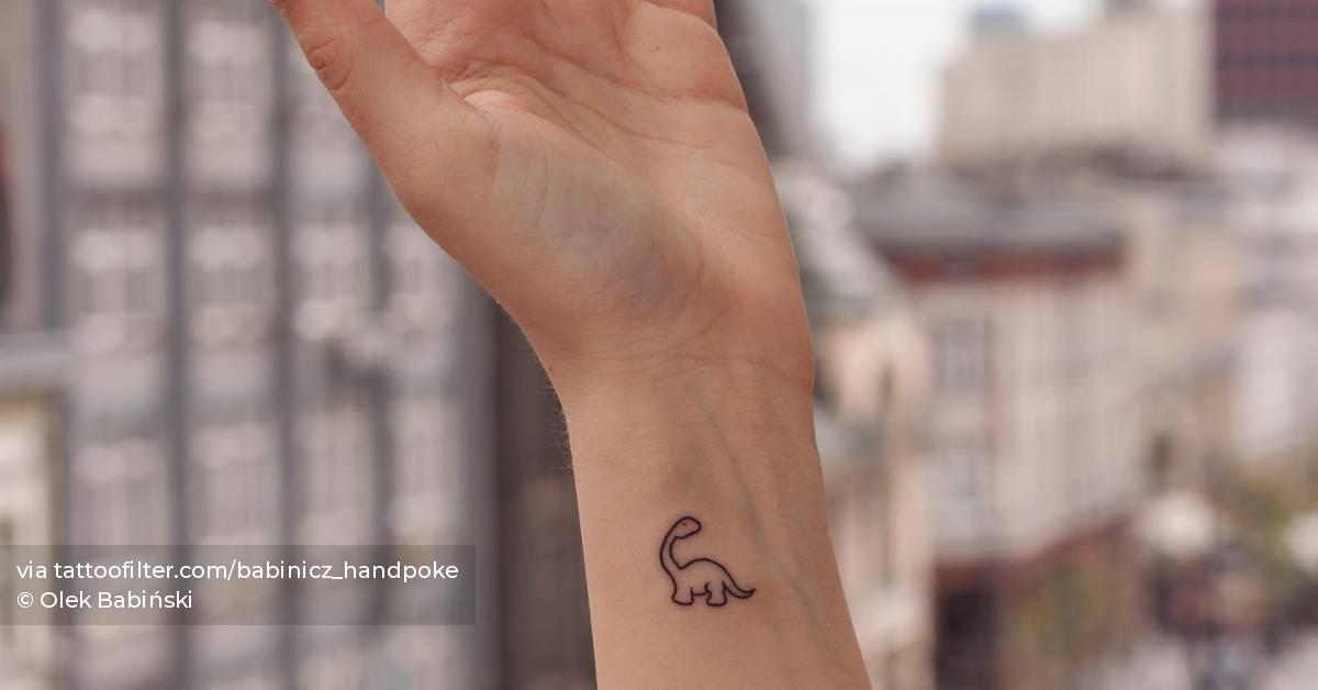 Tiny brontosaurus tattoo located on the wrist, hand
