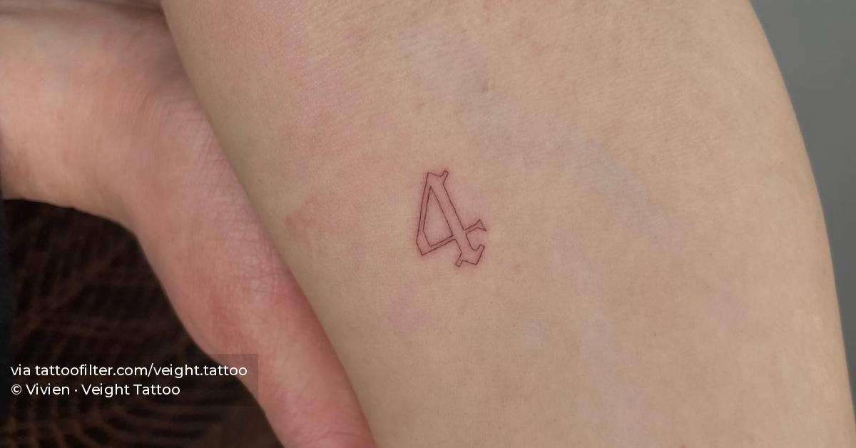 Tattoo of the number "4" located on the inner forearm.