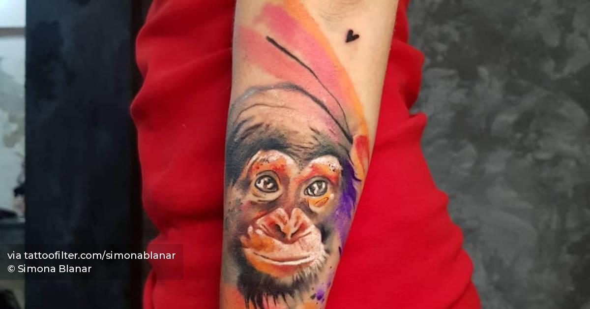 Chimp tattoo done on the forearm, watercolor style.