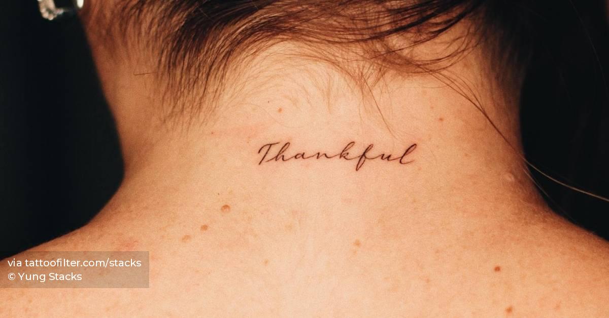Tattoo of the word "thankful" done on the back of the