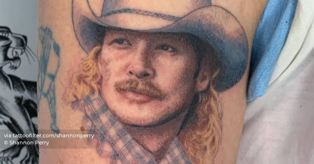 Portrait tattoo of Alan Jackson done on the upper arm,