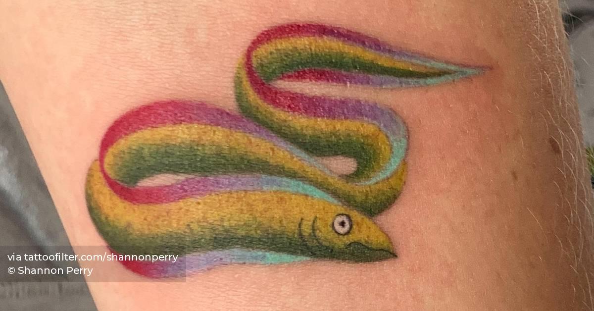 Colorful eel tattoo located on the inner forearm.