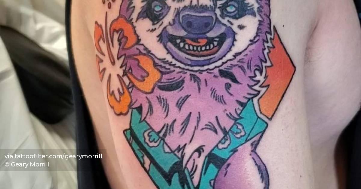 Sloth portrait tattoo located on the upper arm.