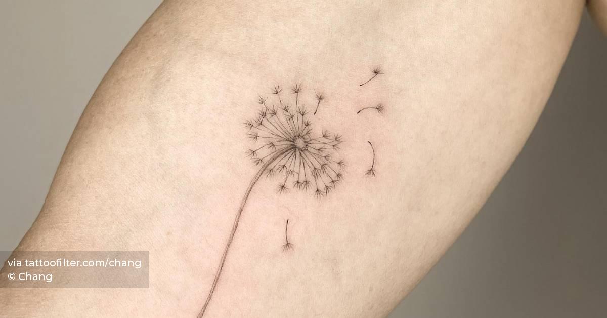Dandelion seed tattoo located on the inner arm, fine