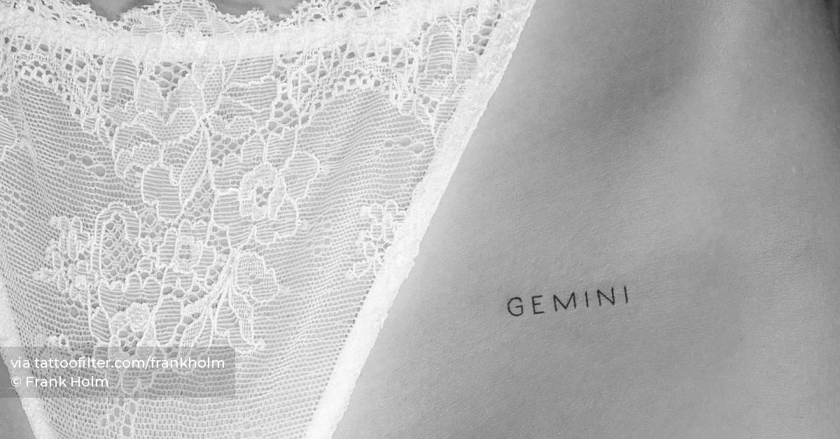 Tattoo of the word "gemini" located on the pelvis.