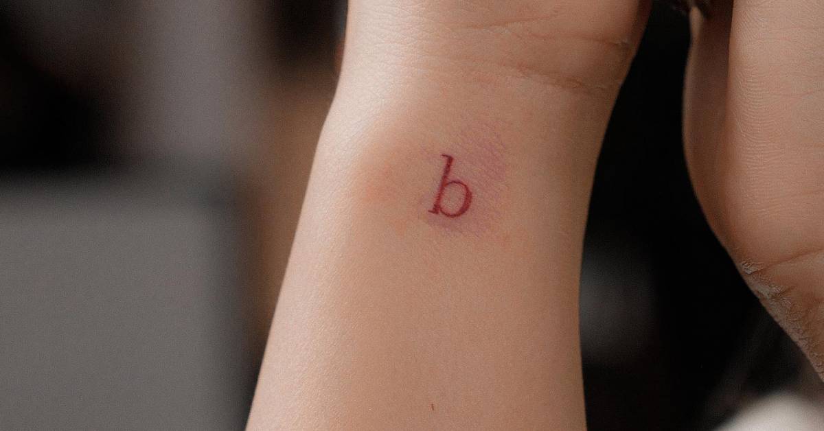 Letter "b" tattoo done on the wrist.