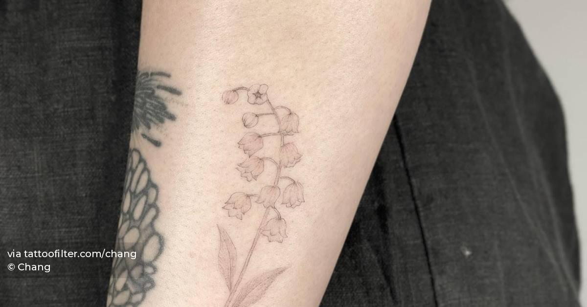 Fine line lily of the valley tattoo located on the