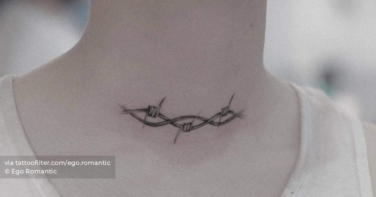 Micro-realistic barbed wire tattoo located on the neck.