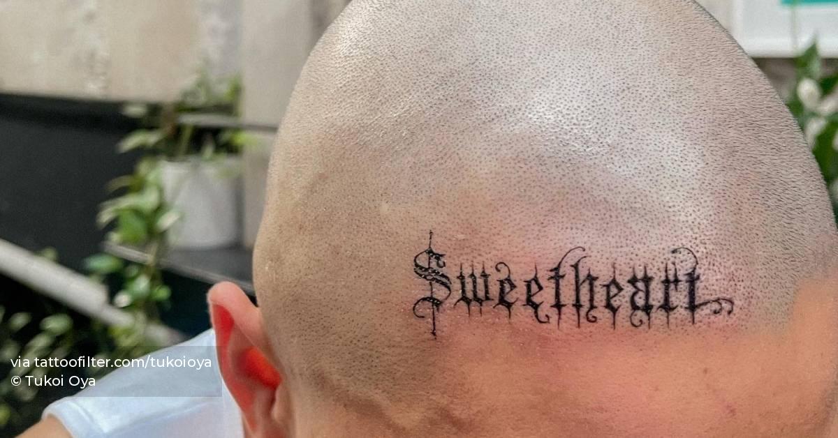 "Sweetheart" lettering tatttoo done on the head.