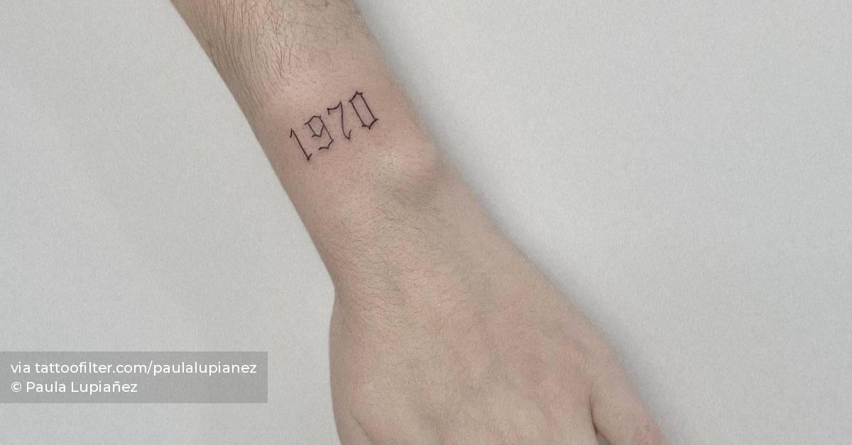 "1970" lettering tattoo located on the wrist.