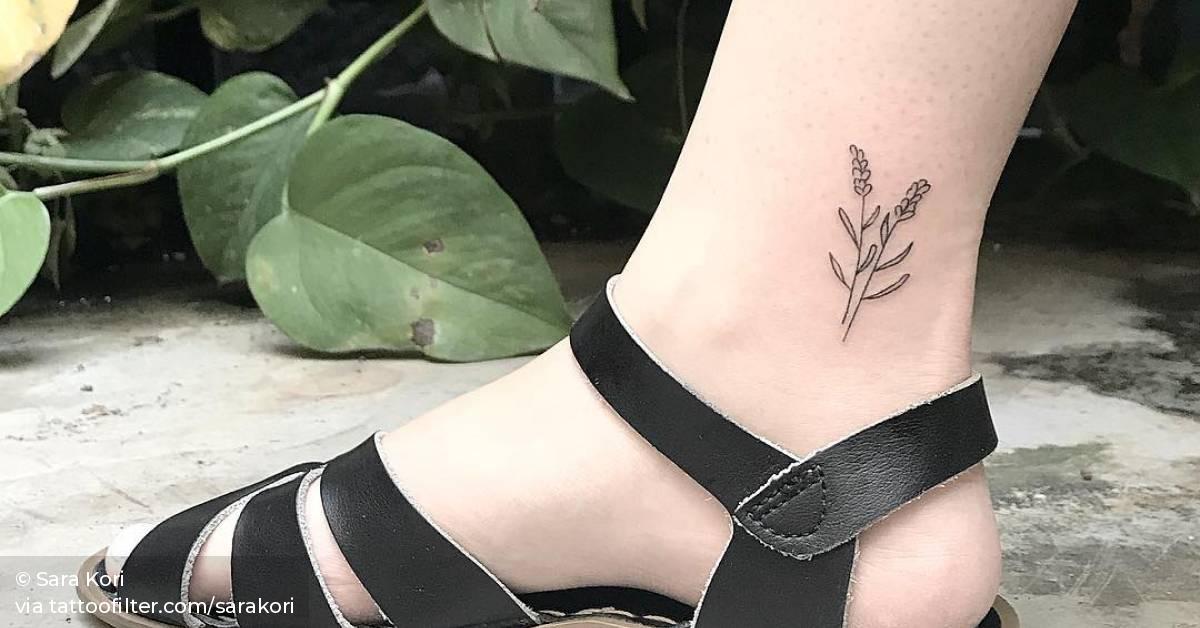 Fine line lavender tattoo on the ankle.