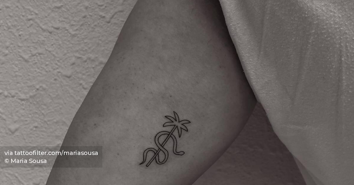 Fine line snake and palm tree tattoo located on the