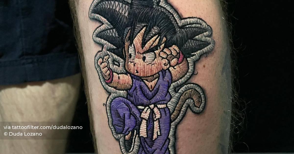 Goku patch tattooed on the shin, emboridery style.