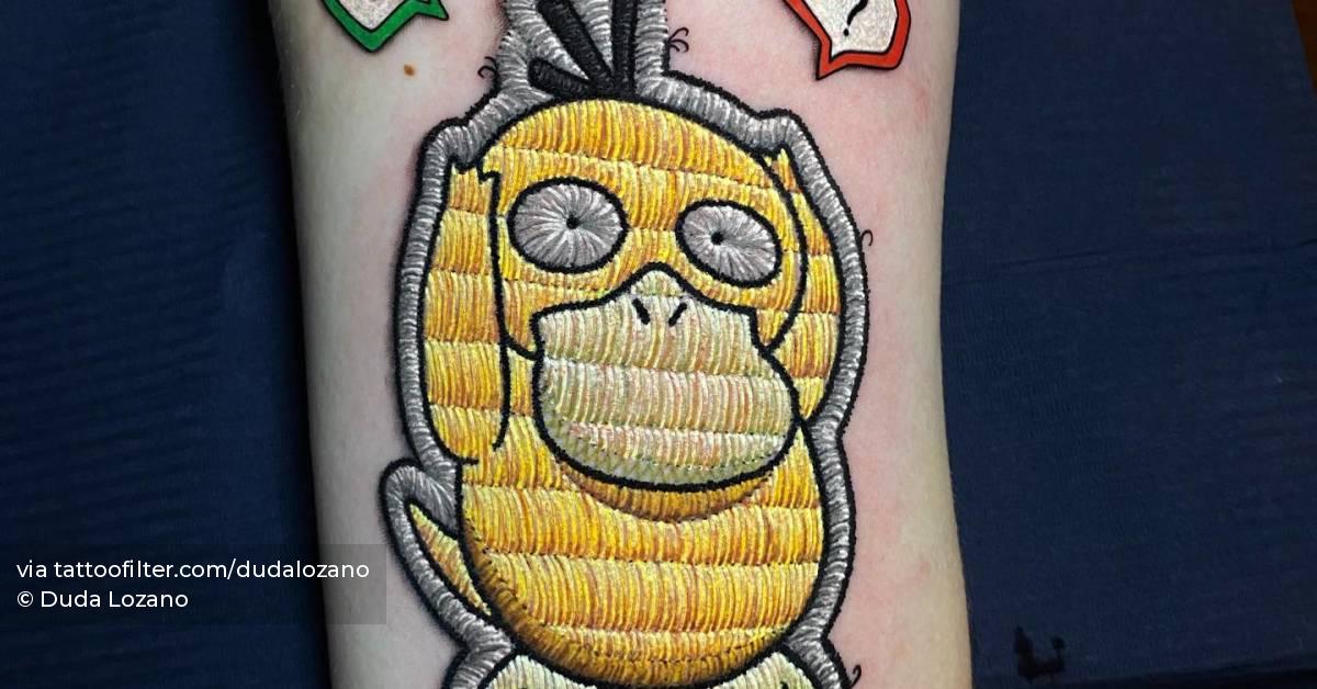 Psyduck patch tattoo done on the thigh.