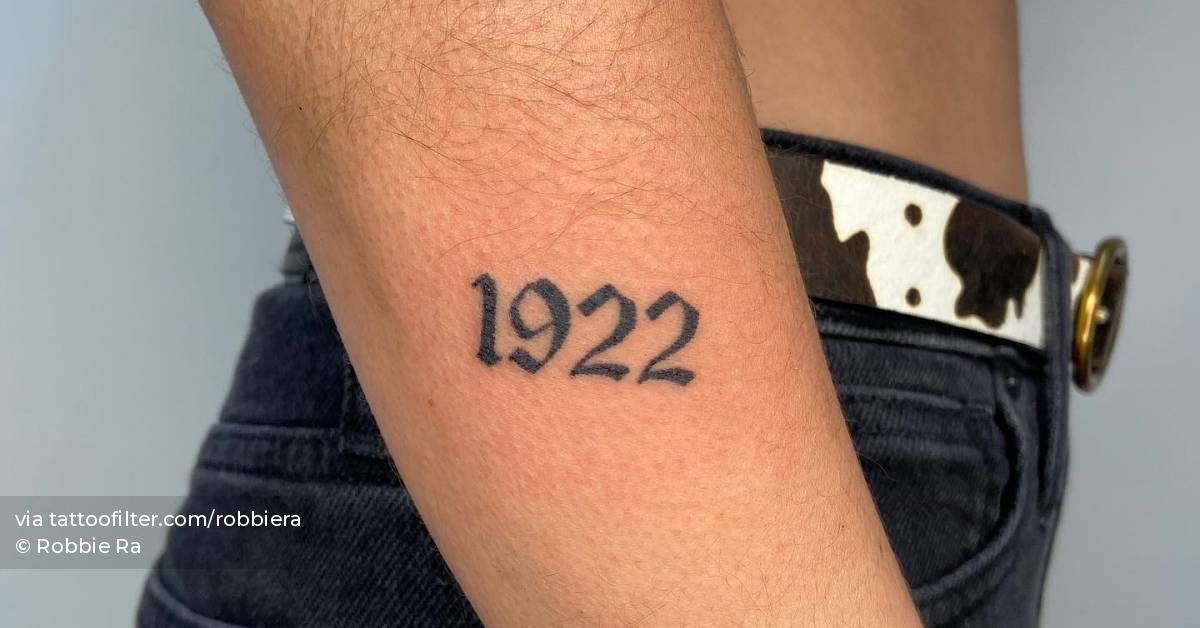 Hand poked "1922" tattoo located on the forearm.