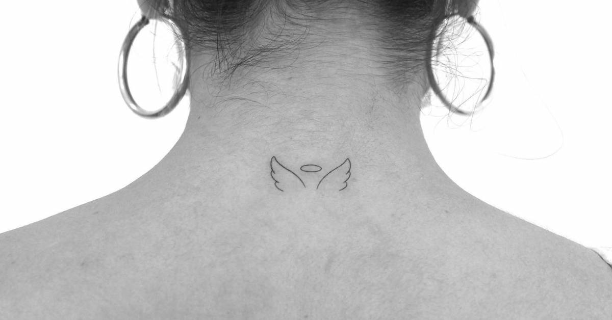 Angel wings tattoo located on the upper back.