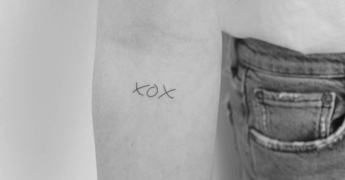 "XOX" tattoo done on the inner forearm.