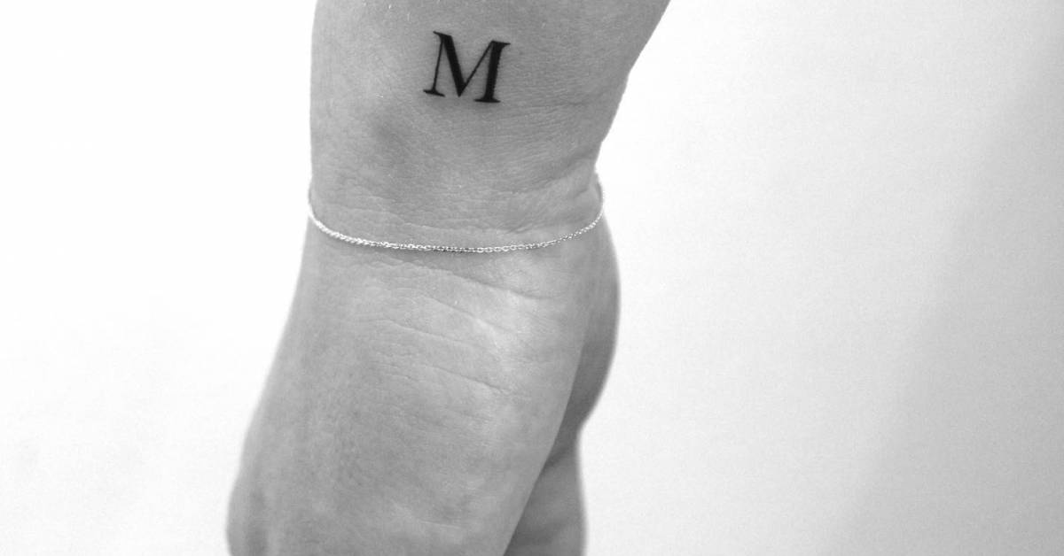 Letter "M" tattoo for her partner.