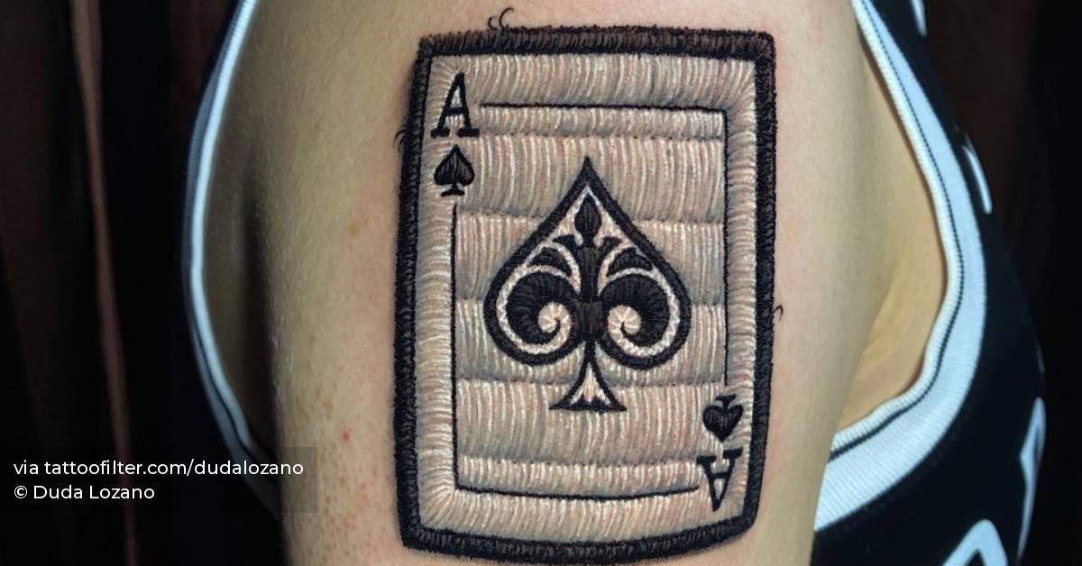 Ace of Spades patch tattoo located on the upper arm.