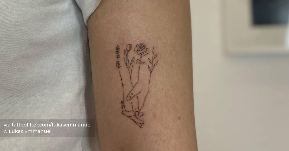 Delicate floral hands tattoo done in fine line, located