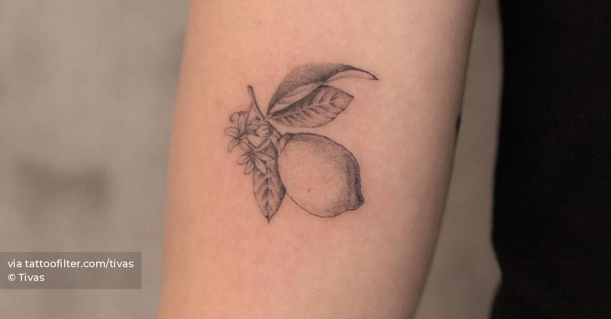 Micro-realistic lemon tattoo done on the upper arm.