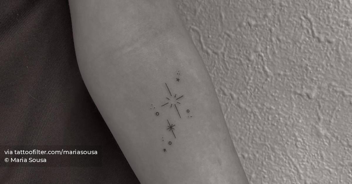 Stars tattoo located on the inner forearm, minimalistic