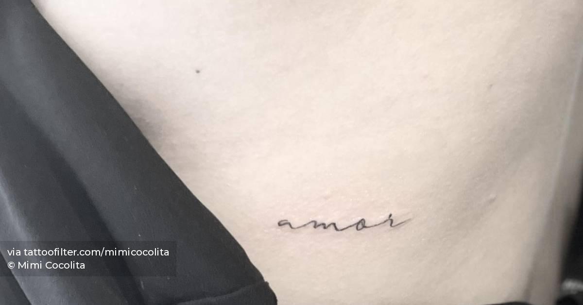 Tattoo of the word "amor" done on the rib.