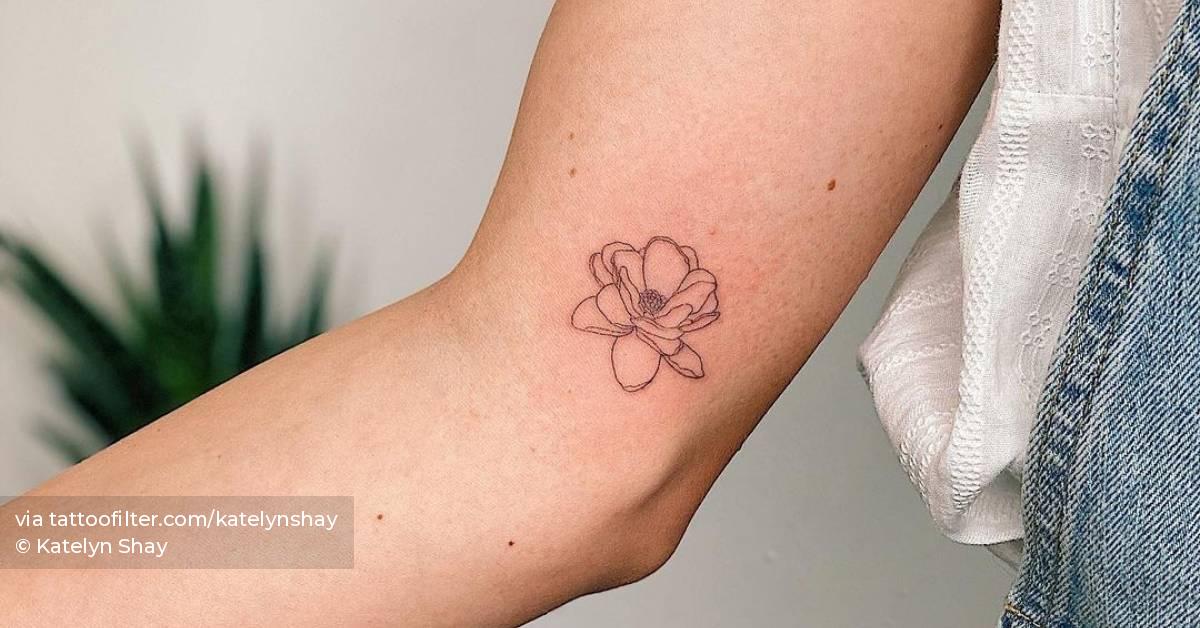 A beautiful magnolia tattooed on inner arm