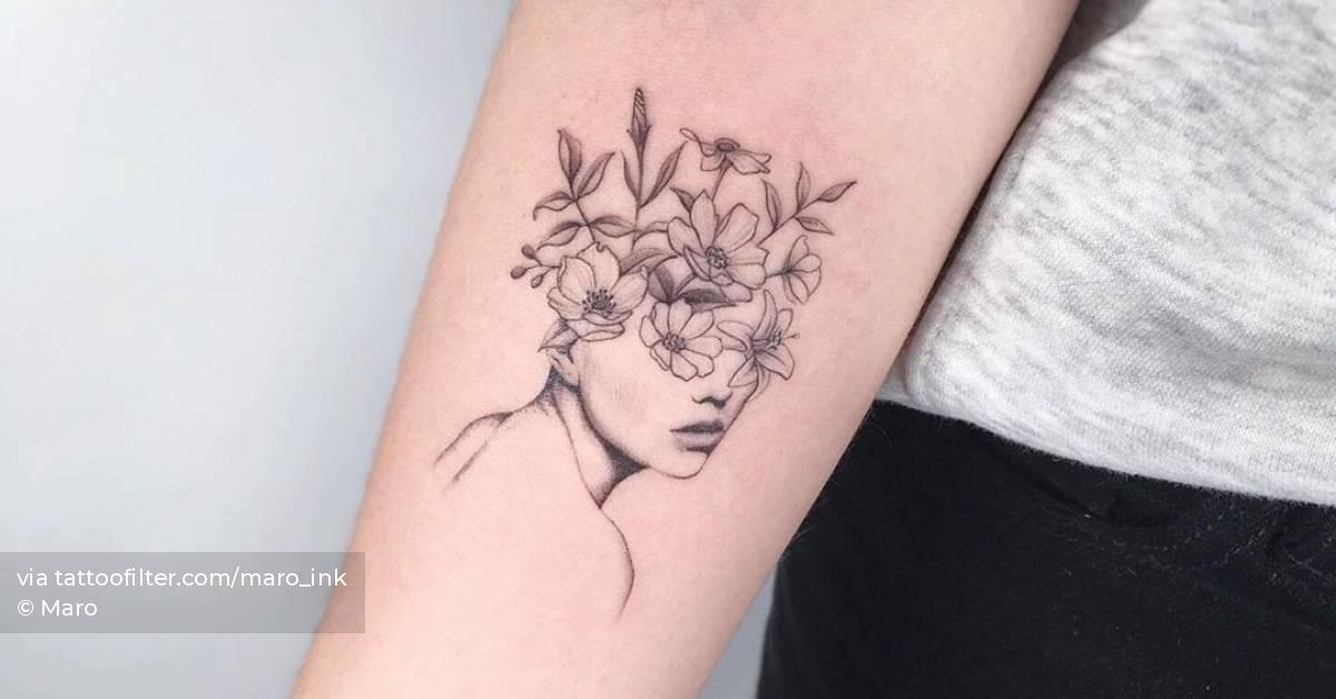 Flower head woman tattoo in fine line
