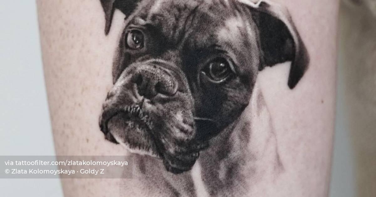 Micro-realistic boxer portrait tattoo on the inner