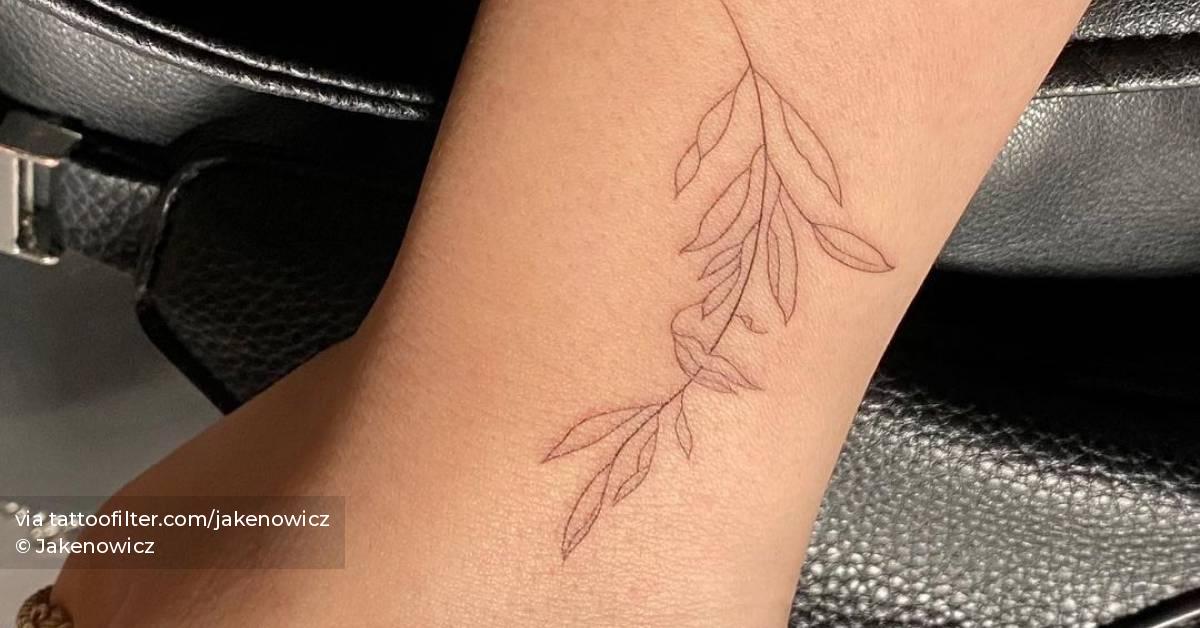 Single needle leaves tattoo on the wrist