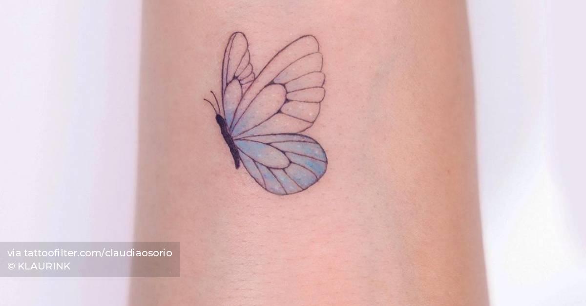 Fine line butterfly tattoo on the wrist.